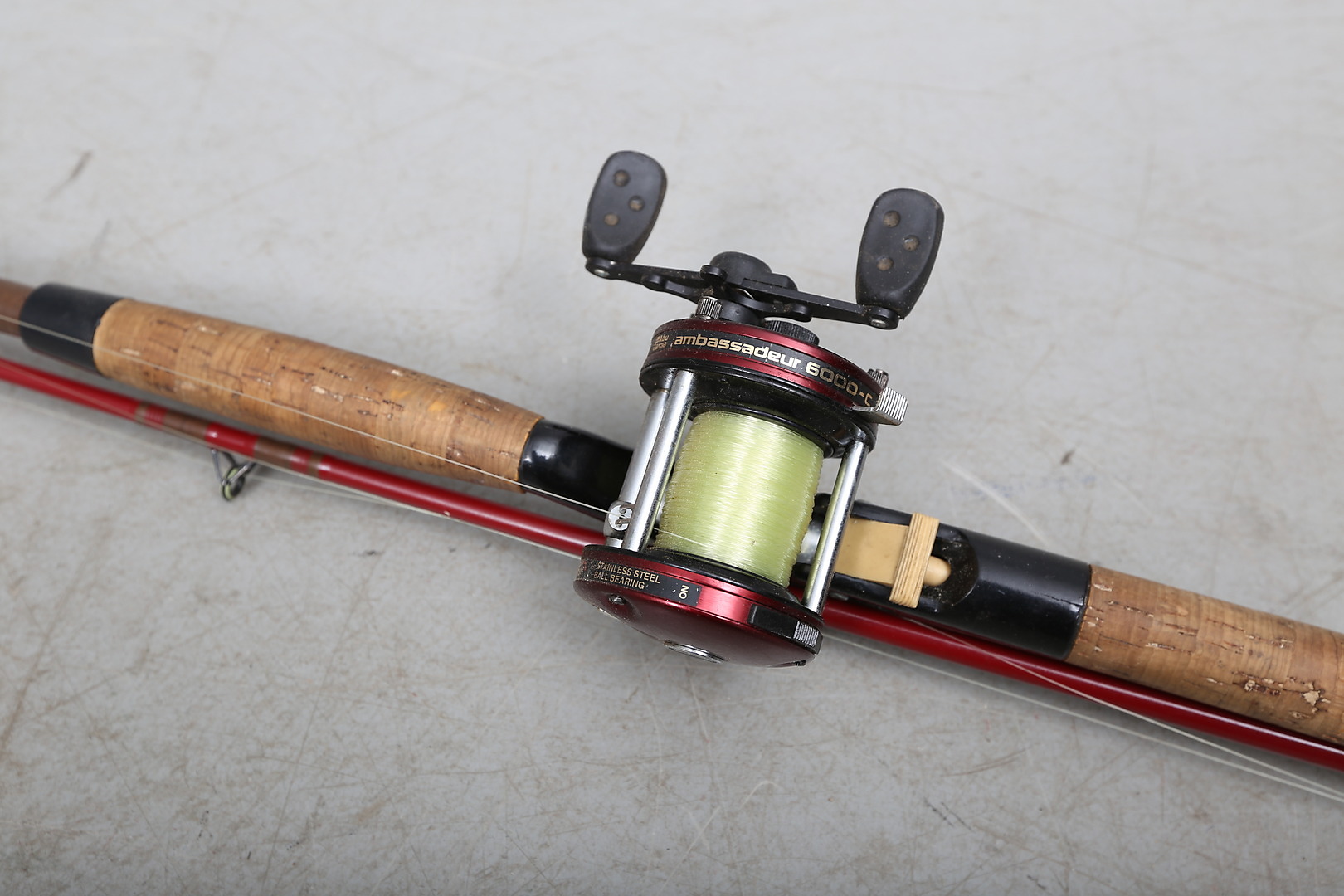 Images for 190490. FISHING ROLL AMBASSADOR 6000, with rod. - Auctionet