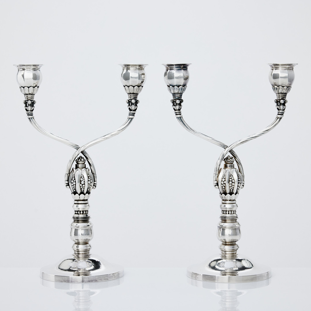 JOHAN ROHDE. A pair of sterling silver candelabra for two candles ...