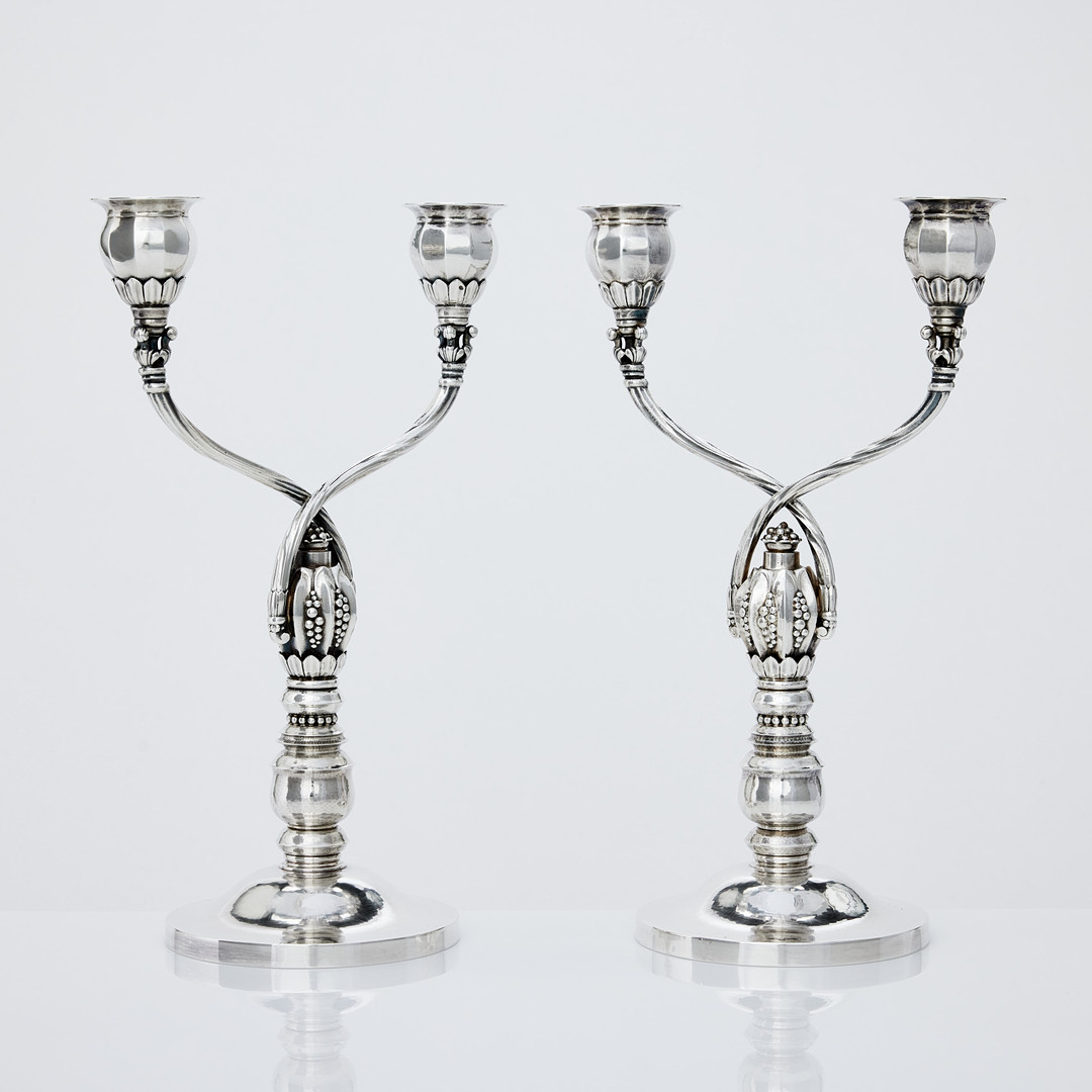 JOHAN ROHDE. A pair of sterling silver candelabra for two candles ...