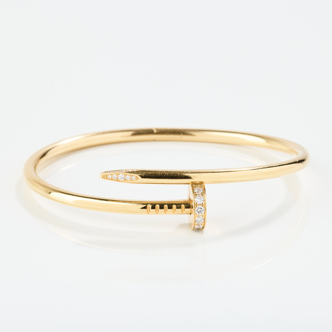 CARTIER. Bangle, “Juste un Clou”, classic model, 18K gold with diamonds ...