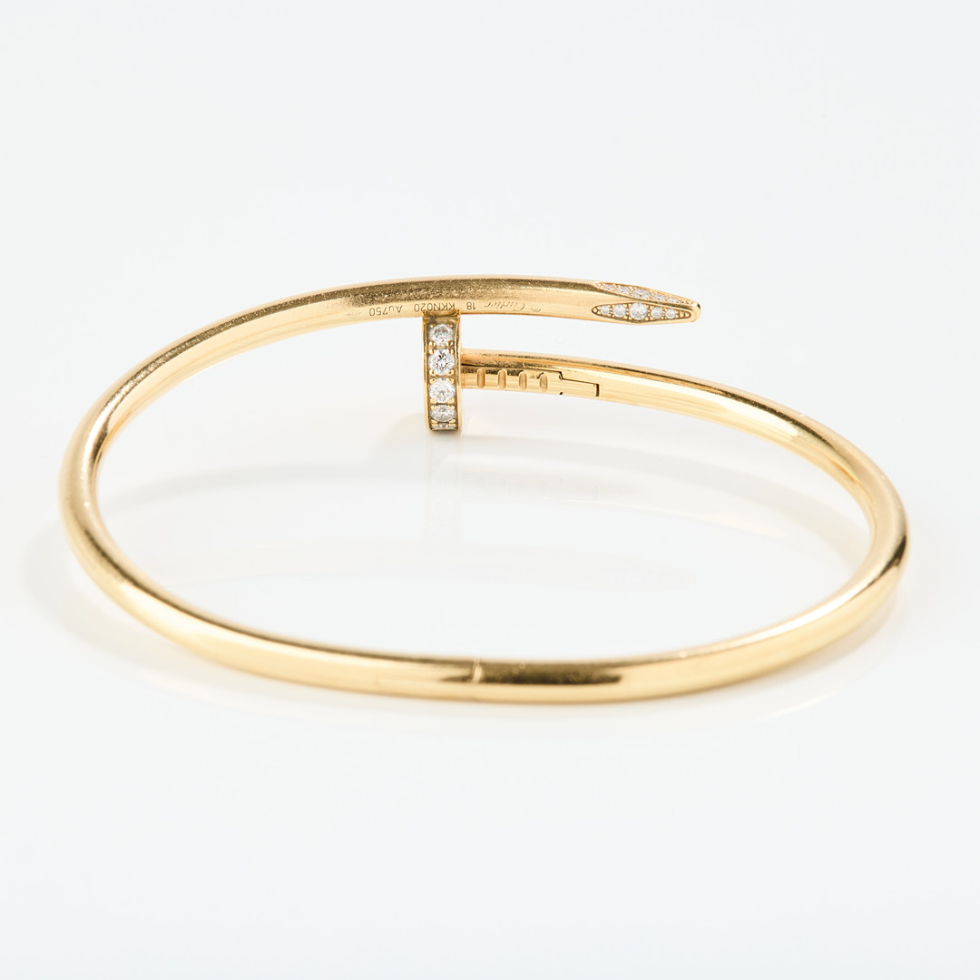 CARTIER. Bangle, “Juste un Clou”, classic model, 18K gold with diamonds ...