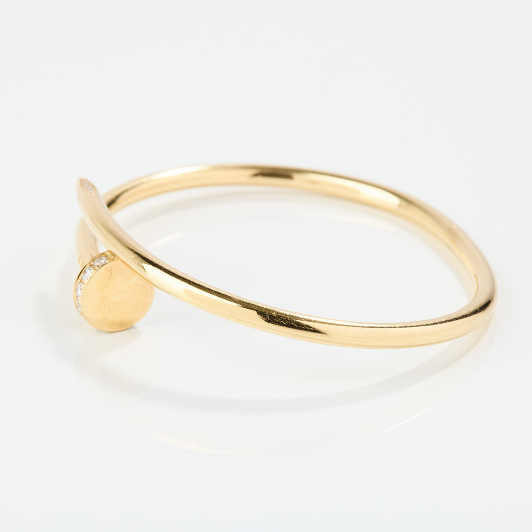 CARTIER. Bangle, “Juste un Clou”, classic model, 18K gold with diamonds ...