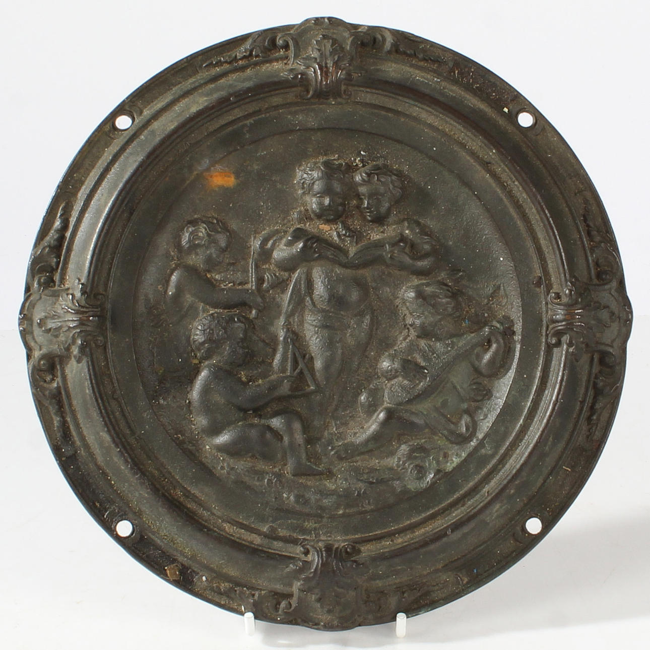 A 19TH CENTURY BRONZE PLAQUE DEPICTING PUTTI PLAYING MUSICAL ...