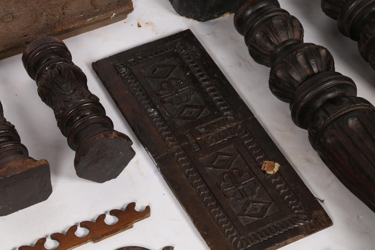 A LARGE COLLECTION OF 17TH CENTURY AND LATER WOOD CARVINGS AND PANELS ...