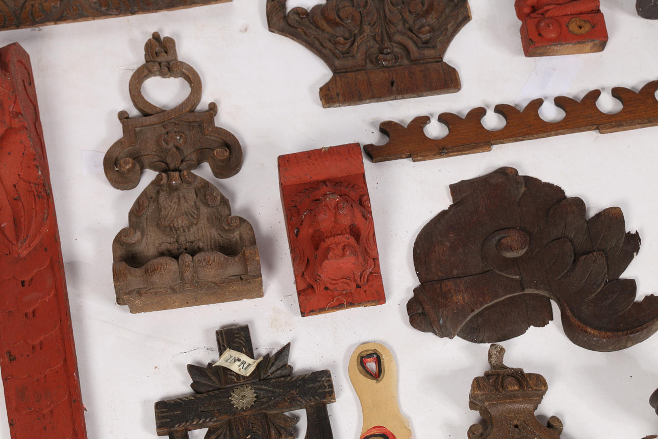 A LARGE COLLECTION OF 17TH CENTURY AND LATER WOOD CARVINGS AND PANELS ...