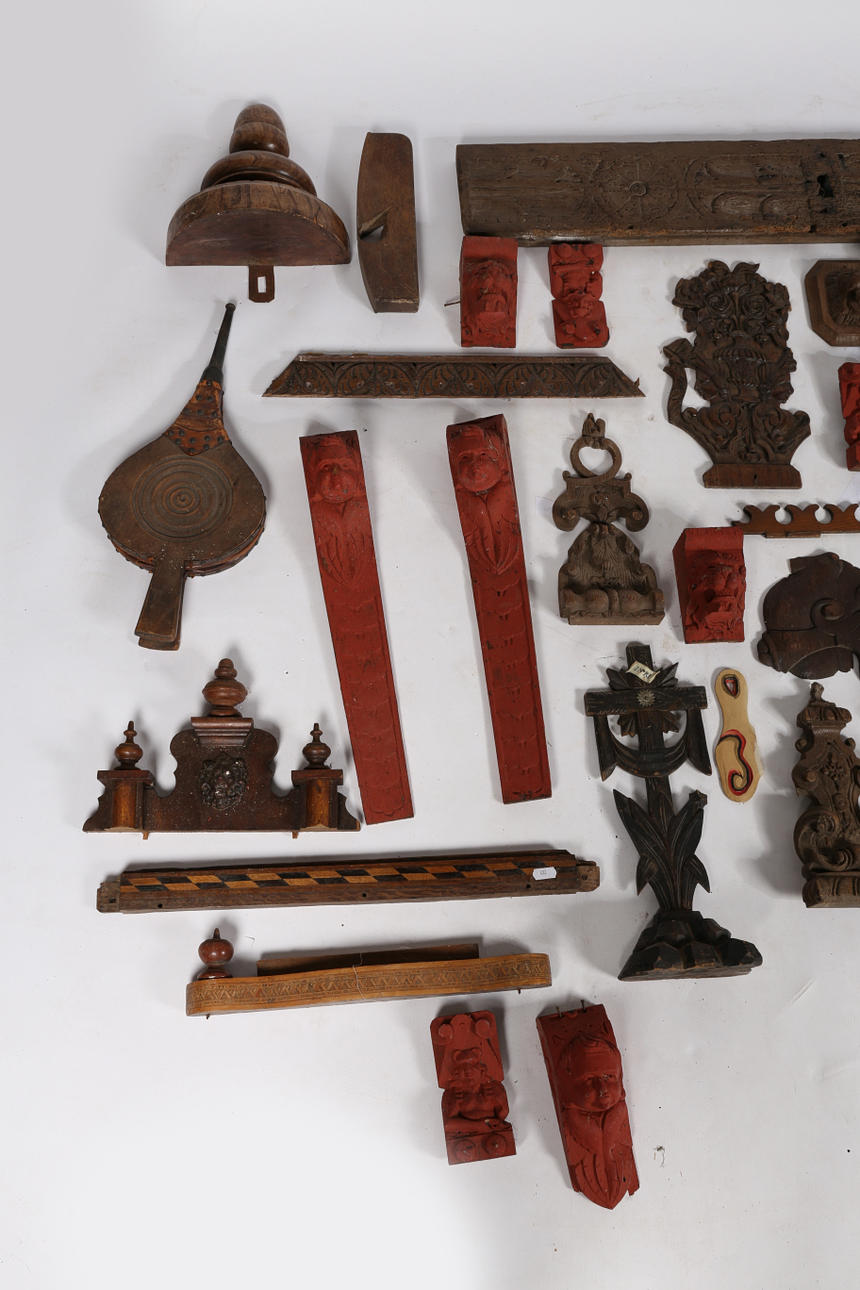 A LARGE COLLECTION OF 17TH CENTURY AND LATER WOOD CARVINGS AND PANELS ...