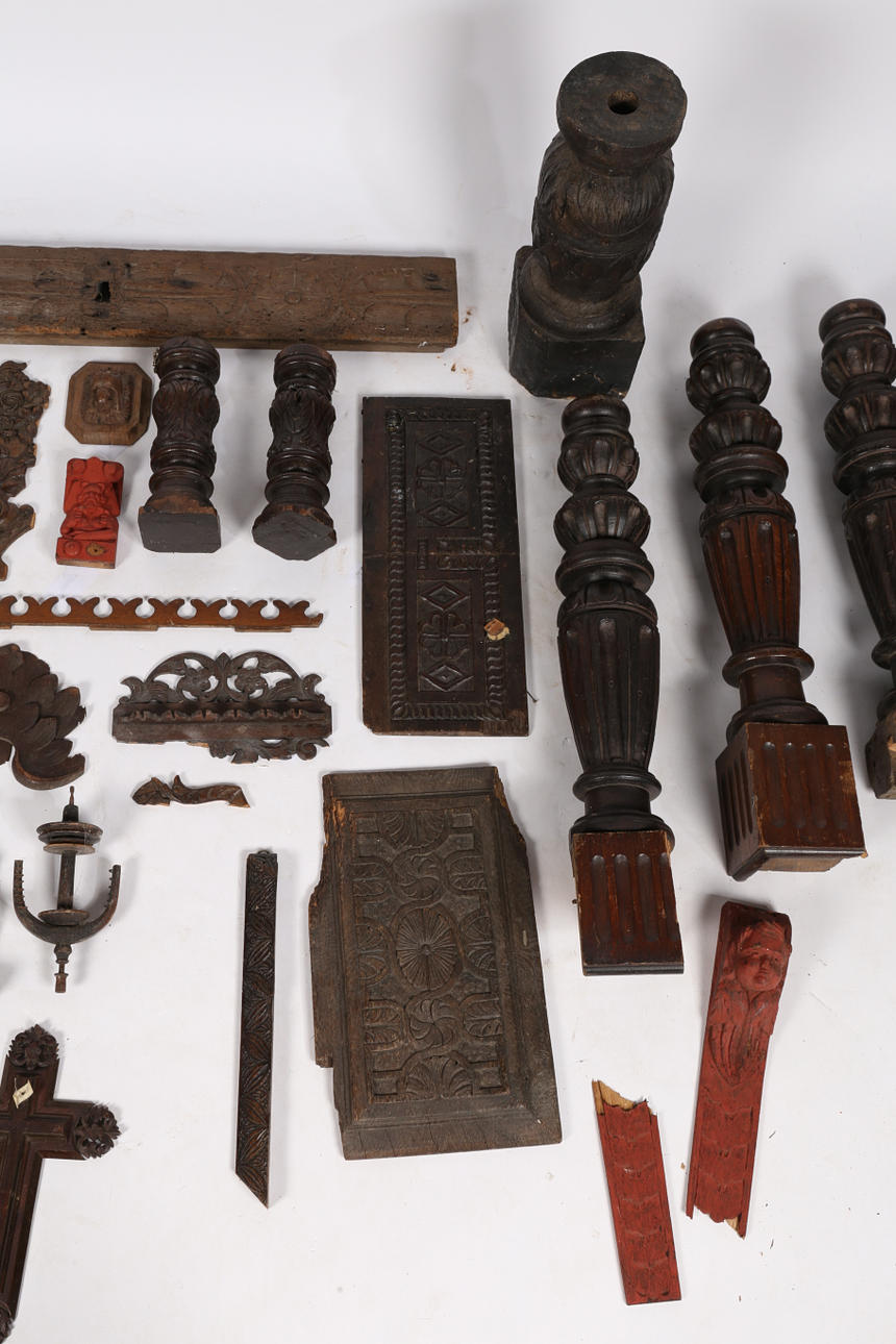 A LARGE COLLECTION OF 17TH CENTURY AND LATER WOOD CARVINGS AND PANELS ...