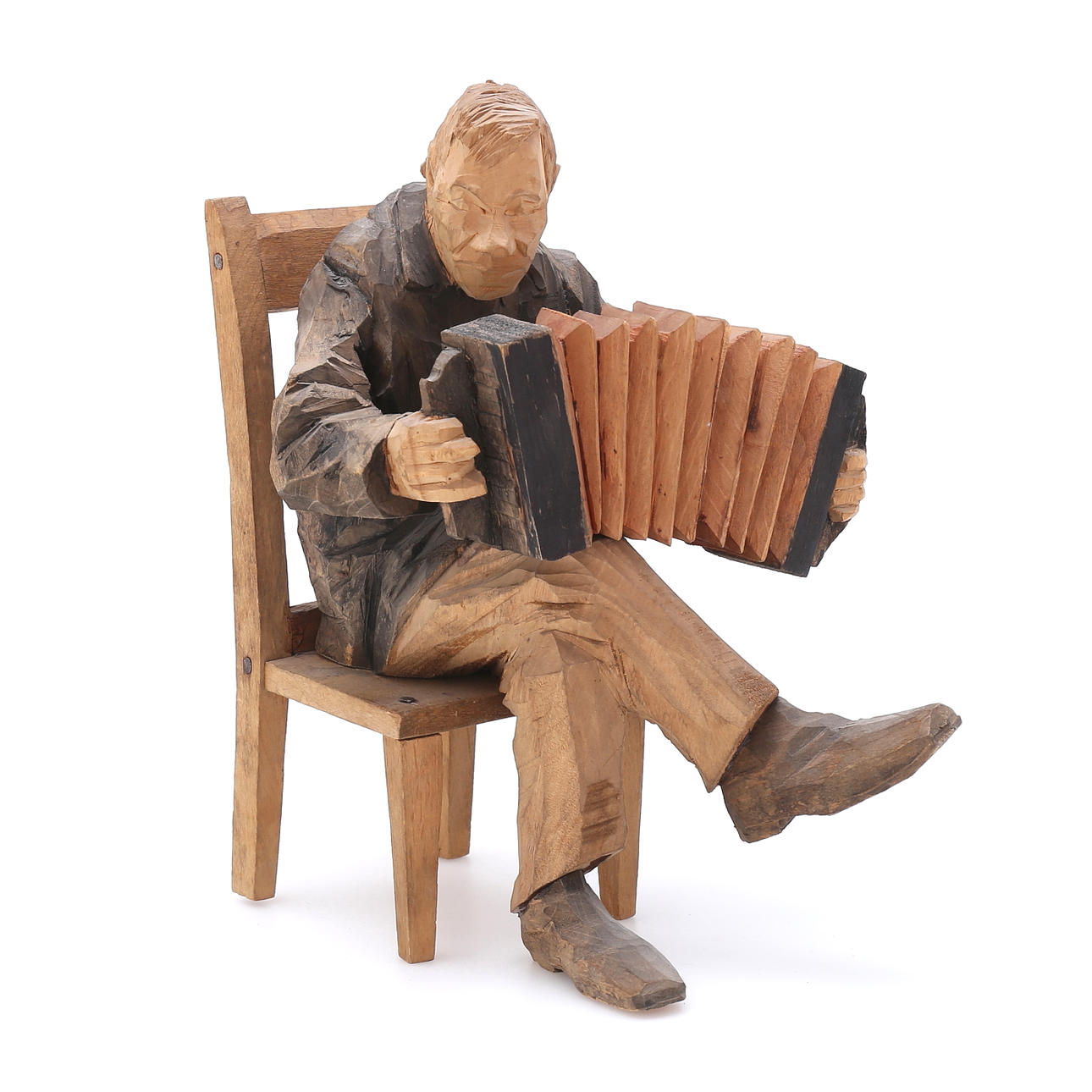 AXEL PETERSSON "DÖDERHULTARN". Skulptur, sittande dragspelare, snidat ...