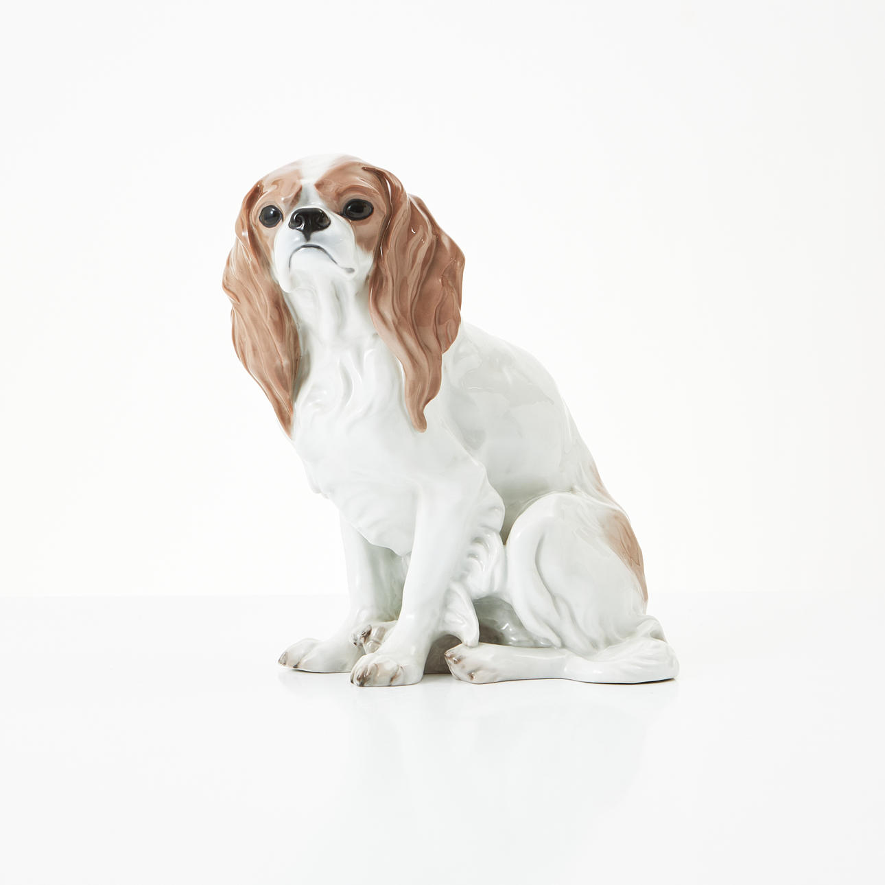 A porcelain figurine, Cavalier king Charles spaniel, model designed ...