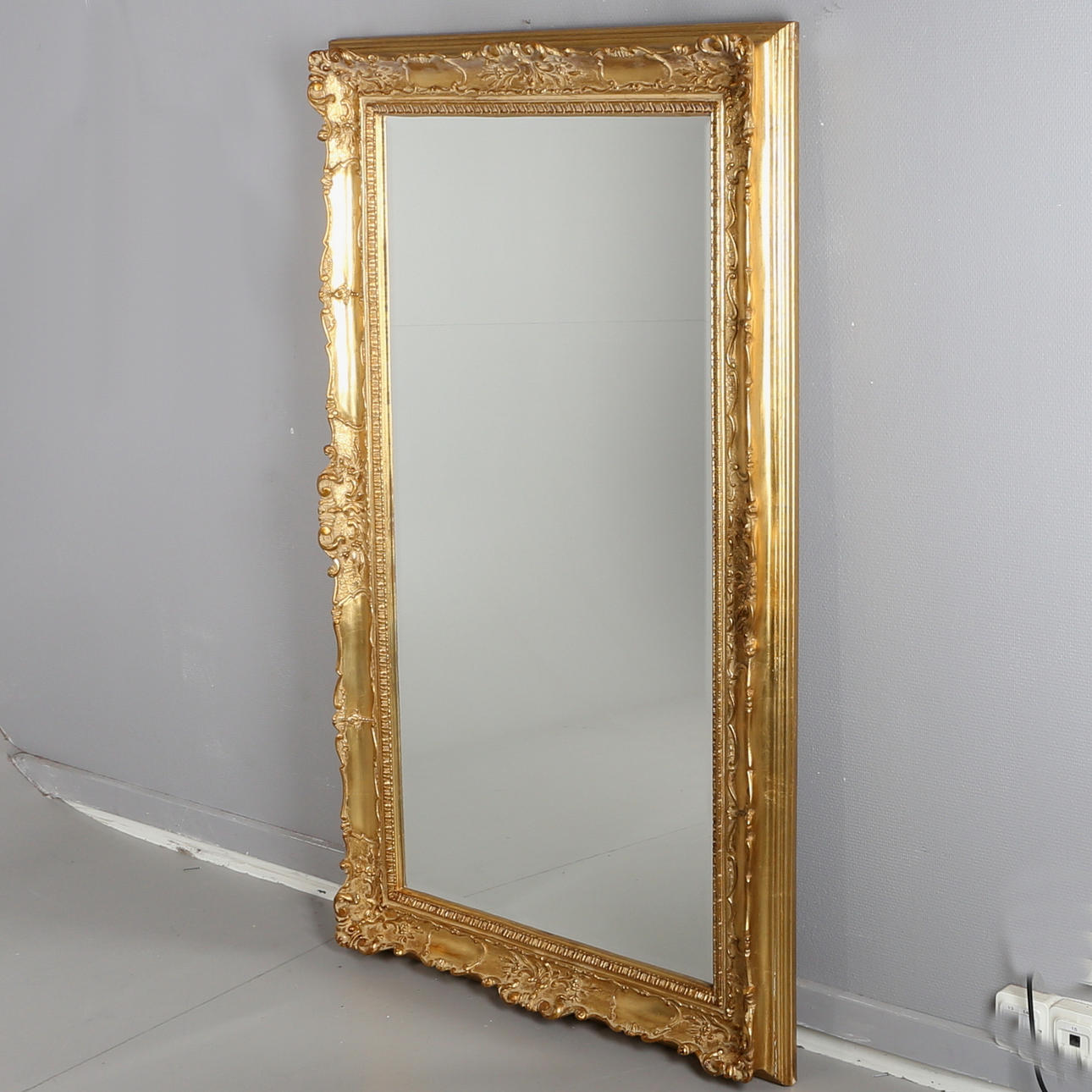 MIRROR, neo-rococo style, gilded with hammered metal, late 20th century ...