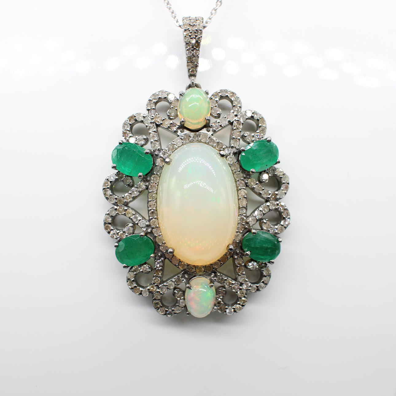 EMERALD, OPAL & DIAMOND NECKLACE. Jewellery & Gemstones - Brooches & Pendants - Auctionet