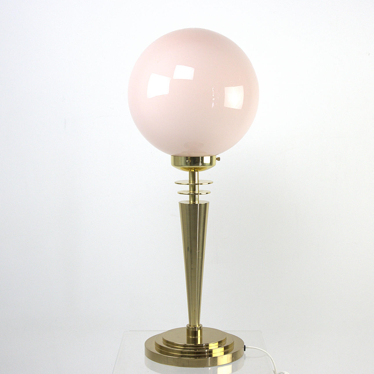 TABLE LAMP, frame of brass, cup of opaque glass, a bright spot, possibly England. Lighting ...