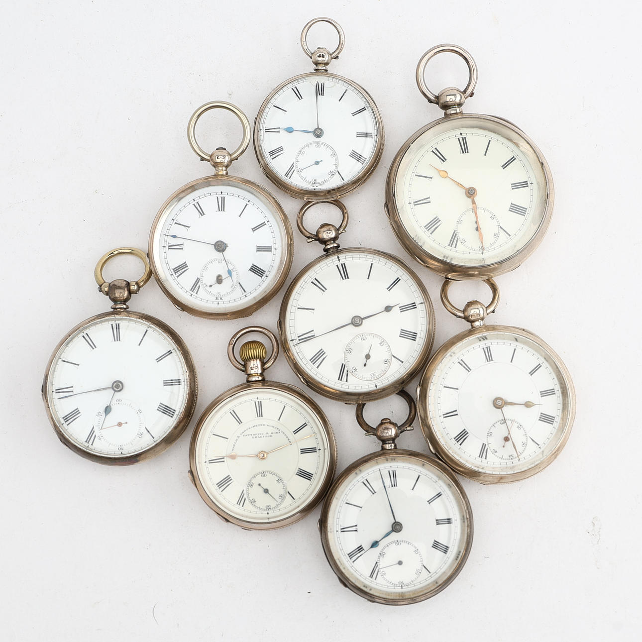 A collection of 8 silver pocket watches, mostly cylinder clocks ...