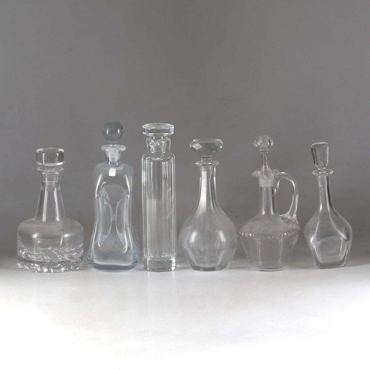 A set of 6 glass decanters, including Orrefors. Glass - Utility glass ...