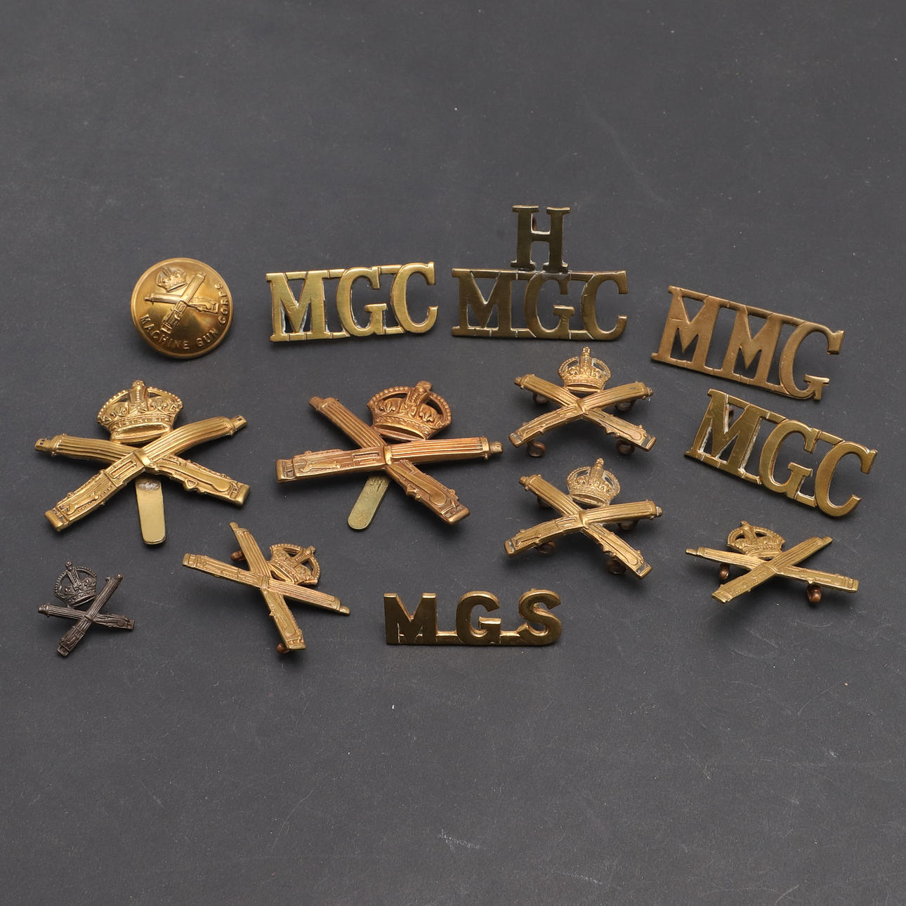 A COLLECTION OF MACHINE GUN CORPS BADGES. Coins, Medals & Stamps ...