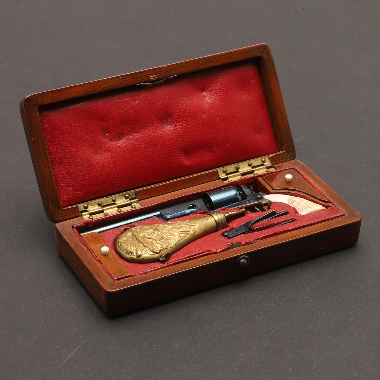A MINIATURE MODEL OF A COLT REVOLVER ATTRIBUTED TO TOM WESTON. Weapons ...