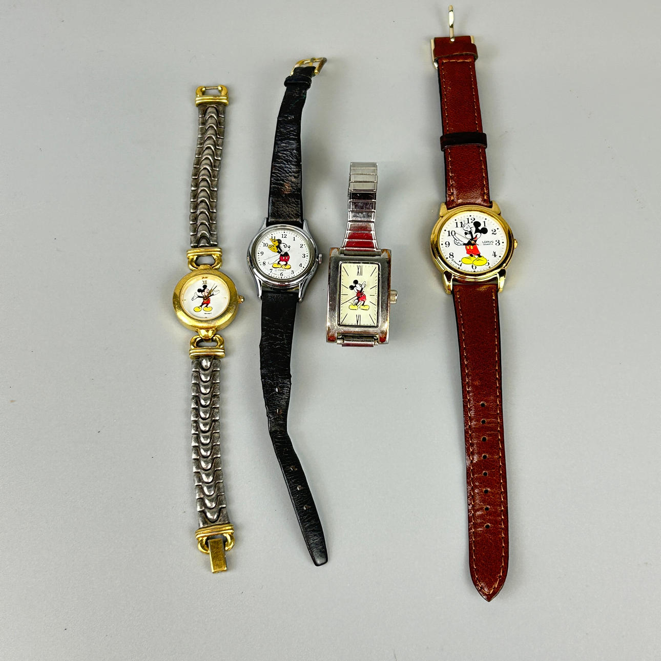 FOUR MICKEY MOUSE WATCHES. Clocks & Watches - Wristwatches - Auctionet