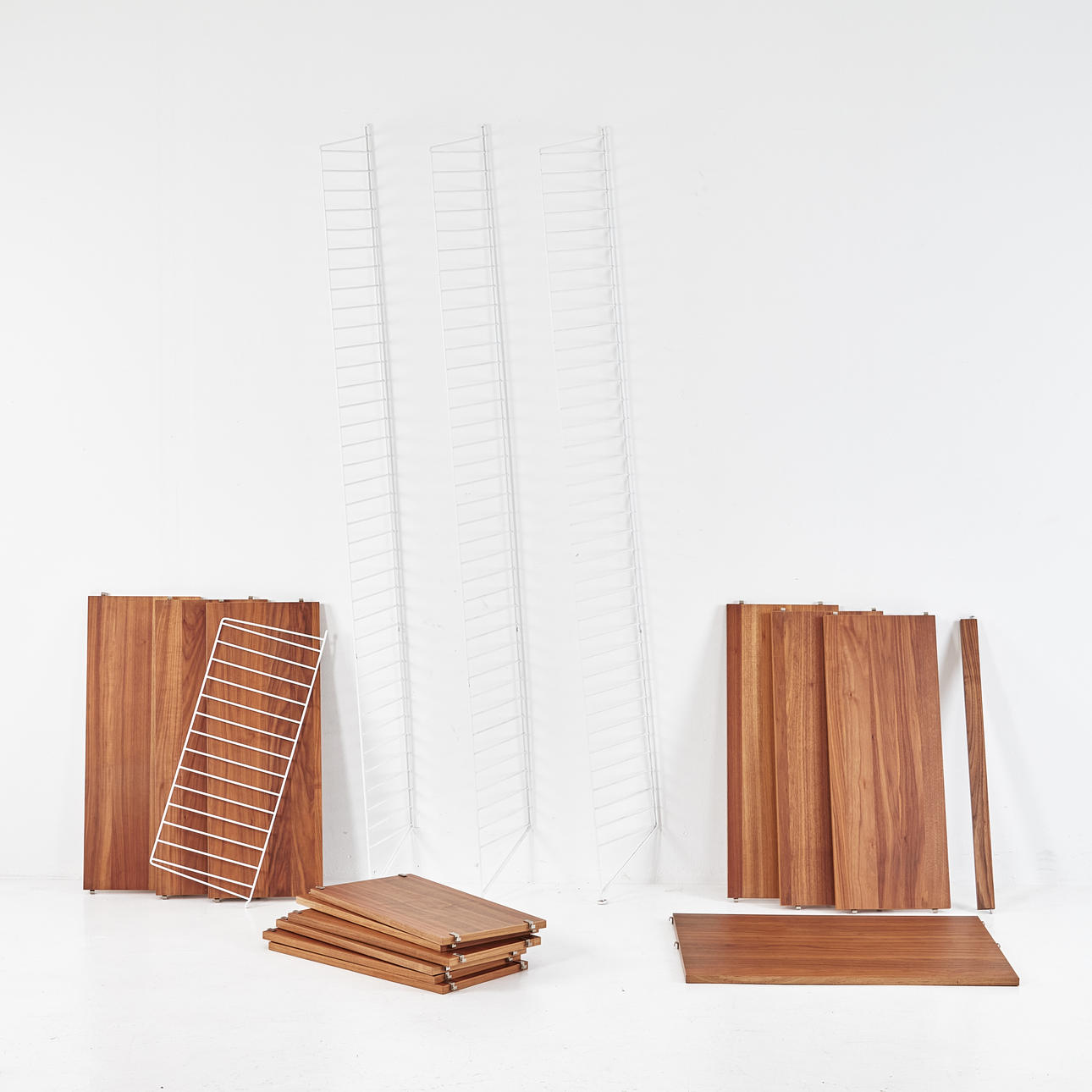 NILS & KAJSA STRINNING. Shelving system, “String”, 17 pieces, veneered in walnut. Furniture ...