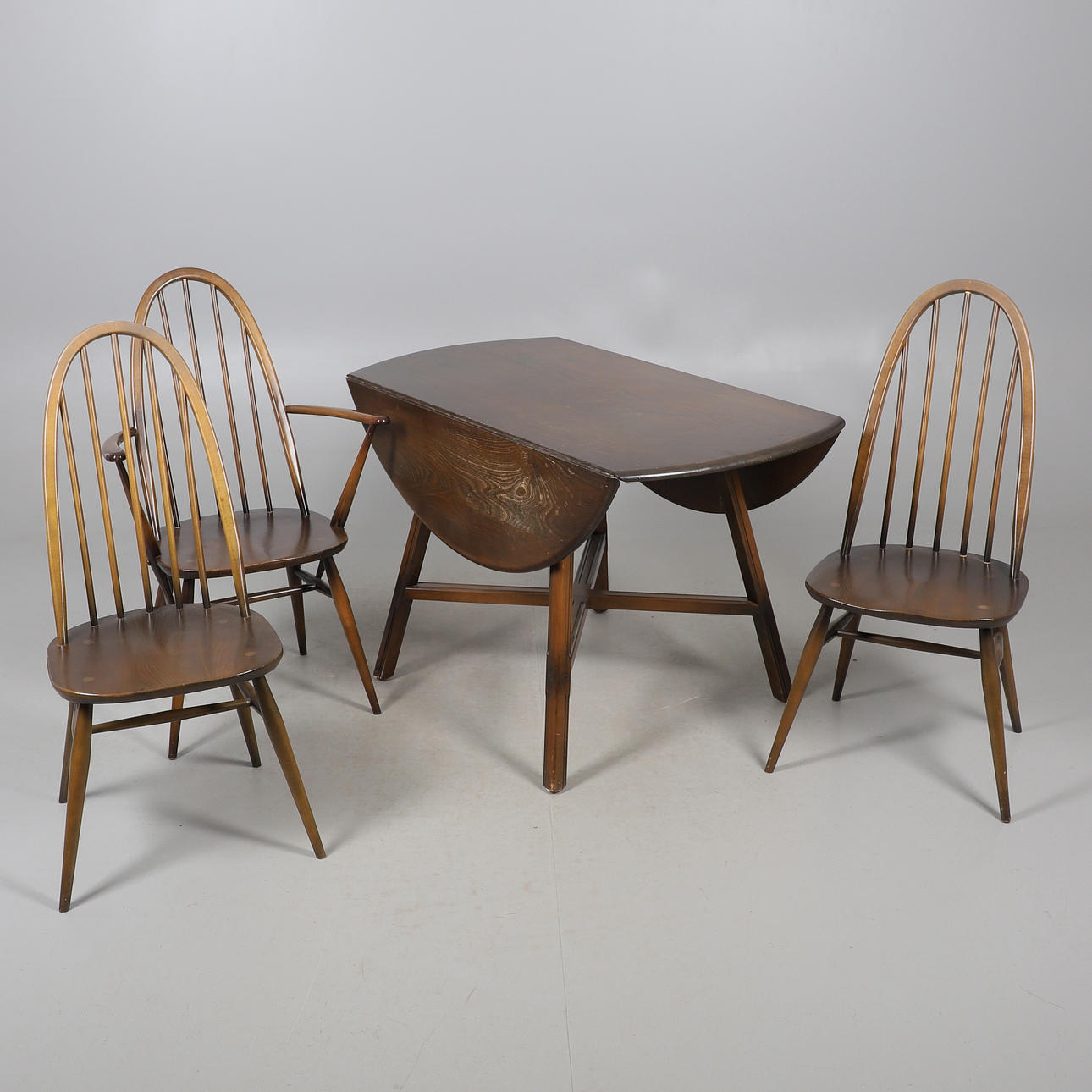AN ERCOL DINING TABLE AND THREE DINING CHAIRS. Furniture - Dining ...