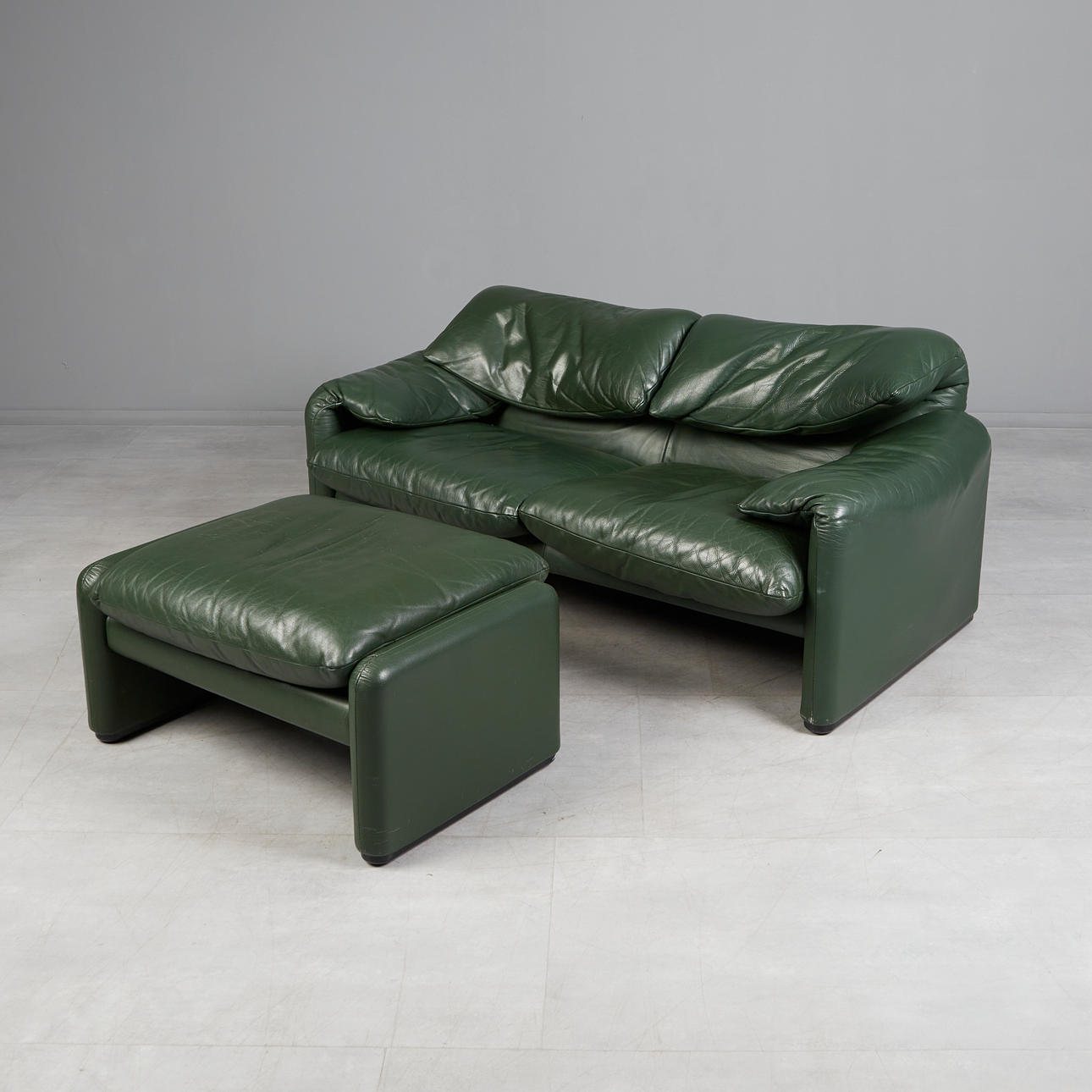VICO MAGISTRETTI. Cassina, two-seater sofa and ottoman, “Maralunga ...