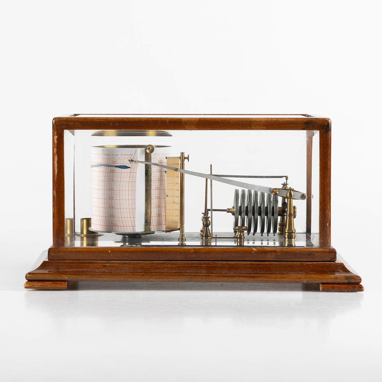 A barograph in a glass case on a wooden plinth, early 20th century ...