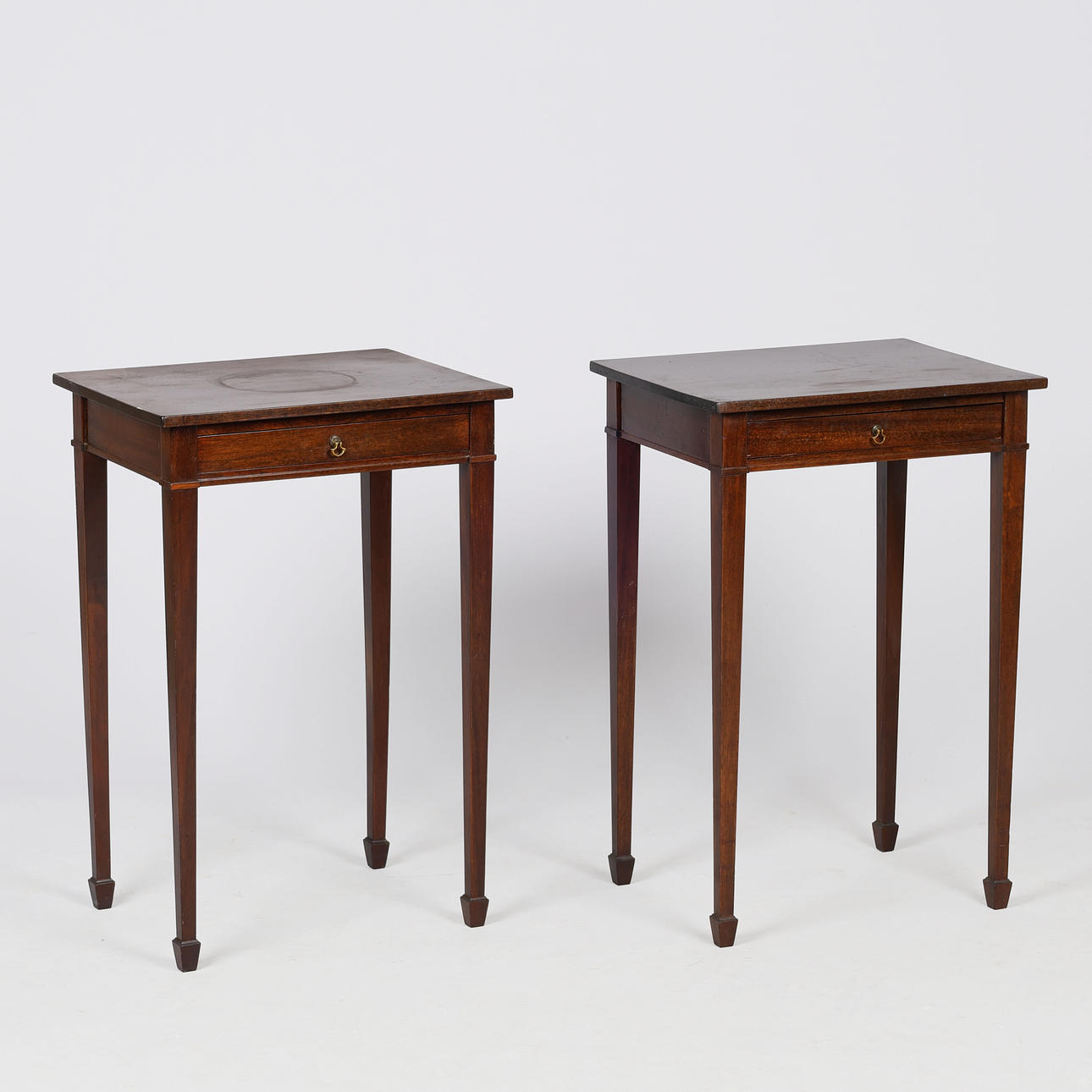A pair of English side tables - mahogany bedside tables with underlying ...