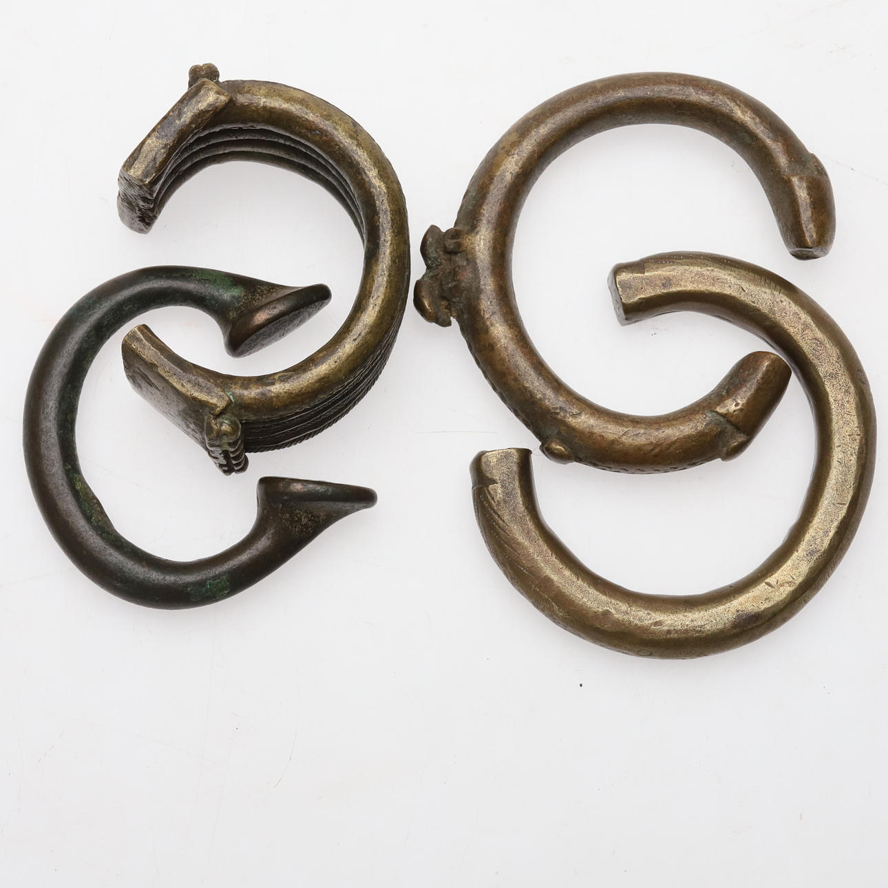A set of four copper/brass manillas, Ivory Coast, Nigeria ...