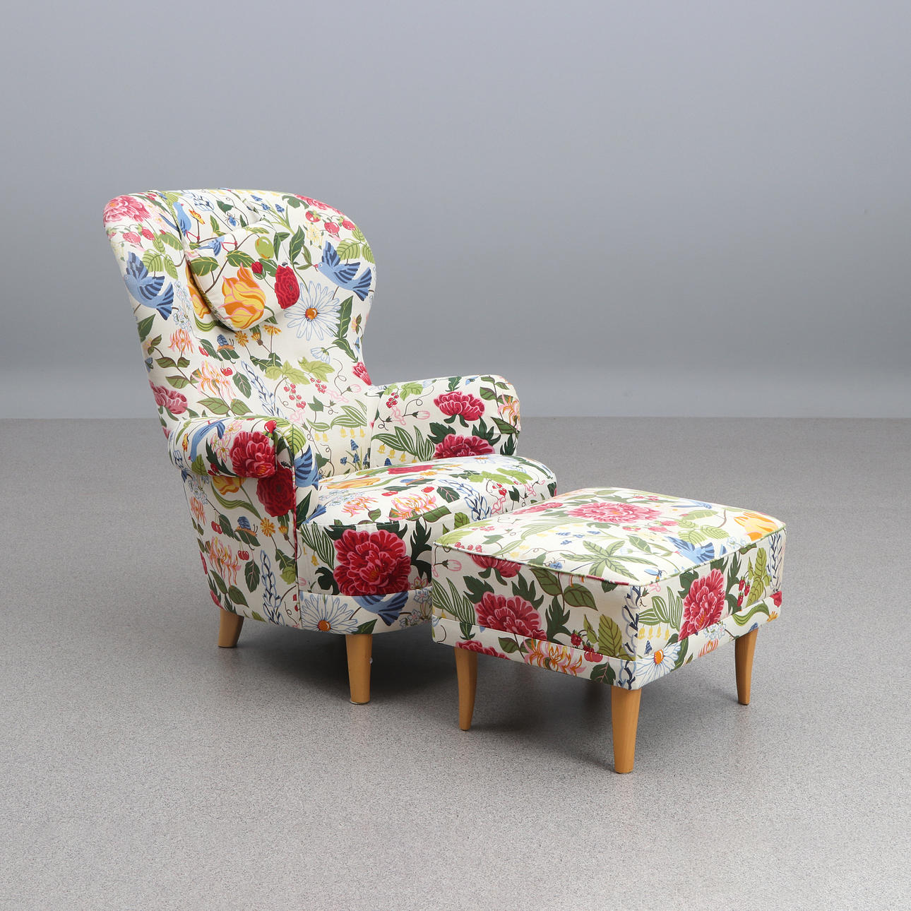CARL MALMSTEN. ARMCHAIR AND FOOTSTOOL. “Round back”. Textile upholstery ...