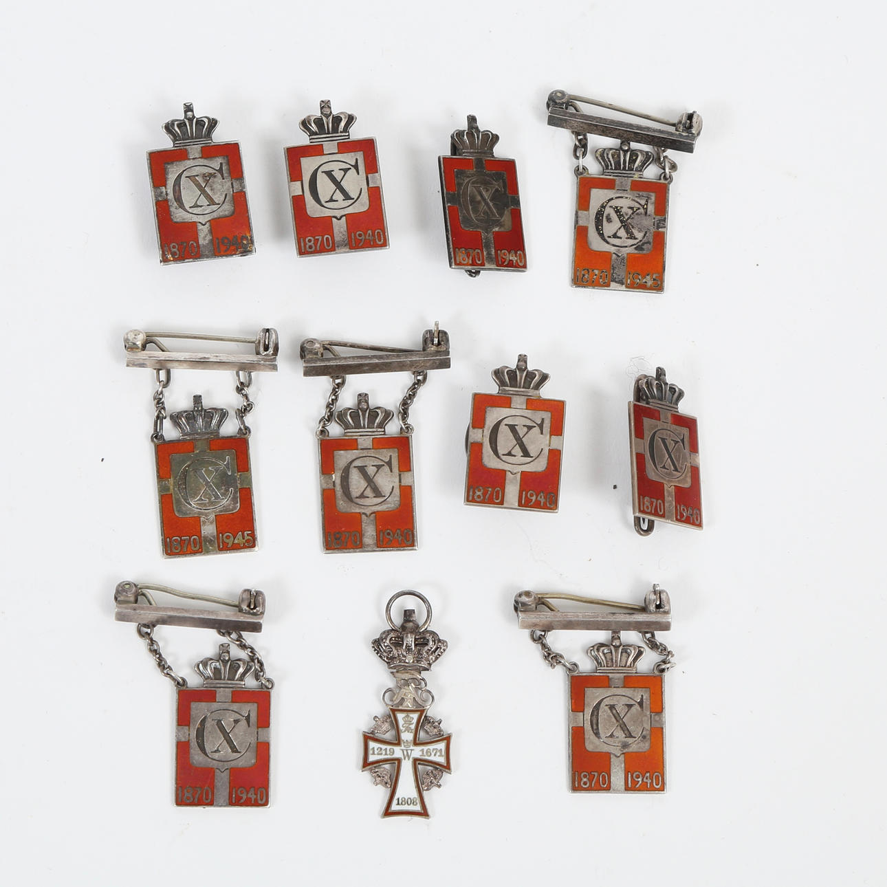 GEORG JENSEN. A miniature knight's cross and ten sterling silver royal ...
