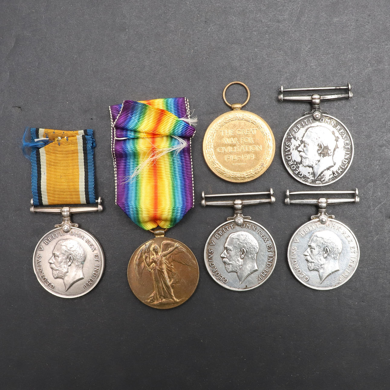 A FIRST WORLD WAR PAIR TO THE ROYAL NAVY AND FOUR SINGLE MEDALS. Coins ...