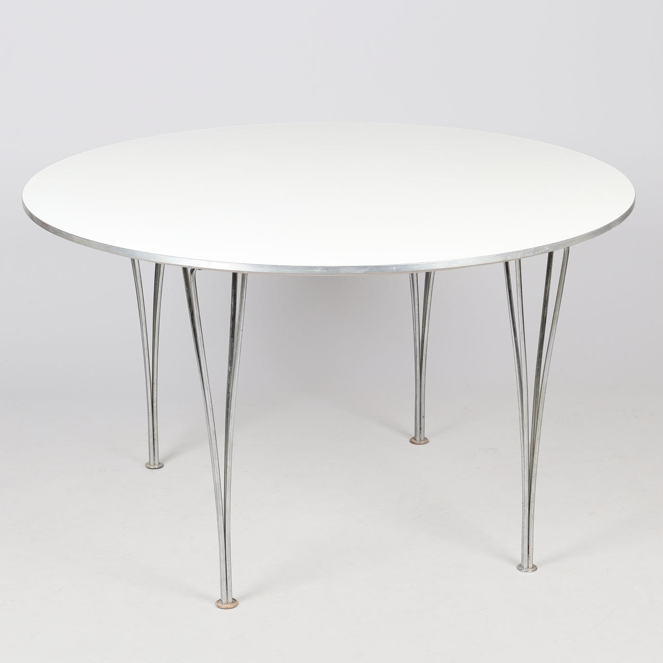 BRUNO MATHSSON / PIET HEIN. Circular/round table, white laminate, alloy ...