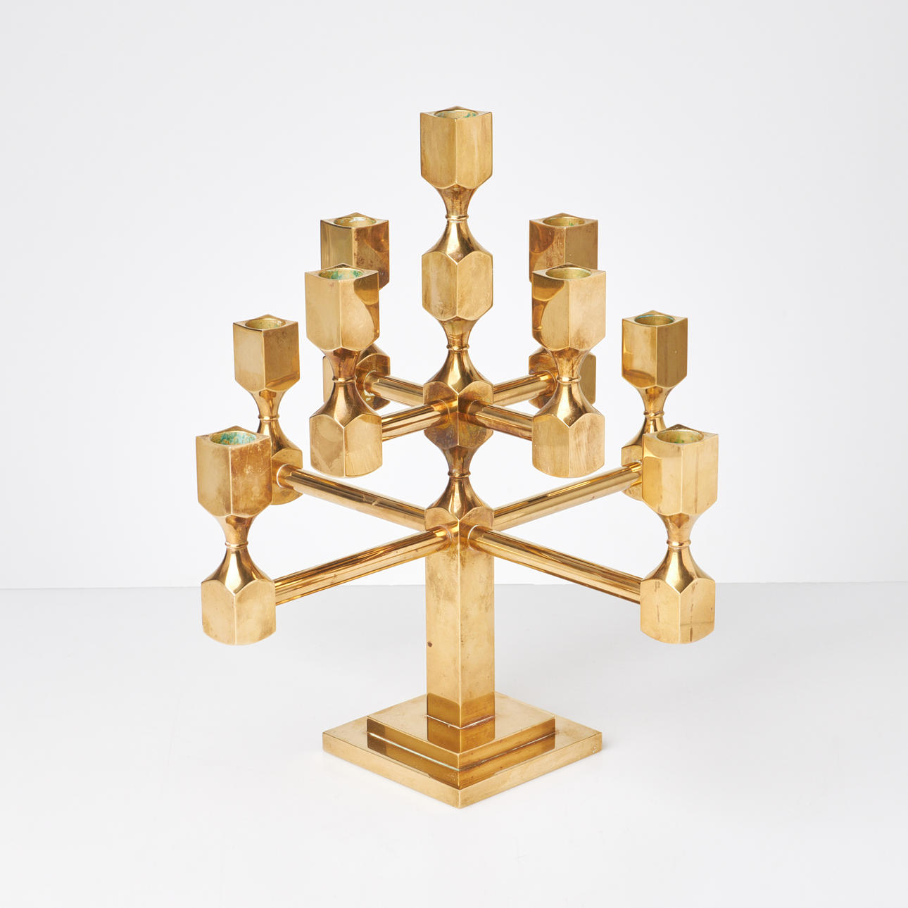 LARS BERGSTEN. A nine-arm candelabra, brass, dated 1981, GUSUM. Silver ...