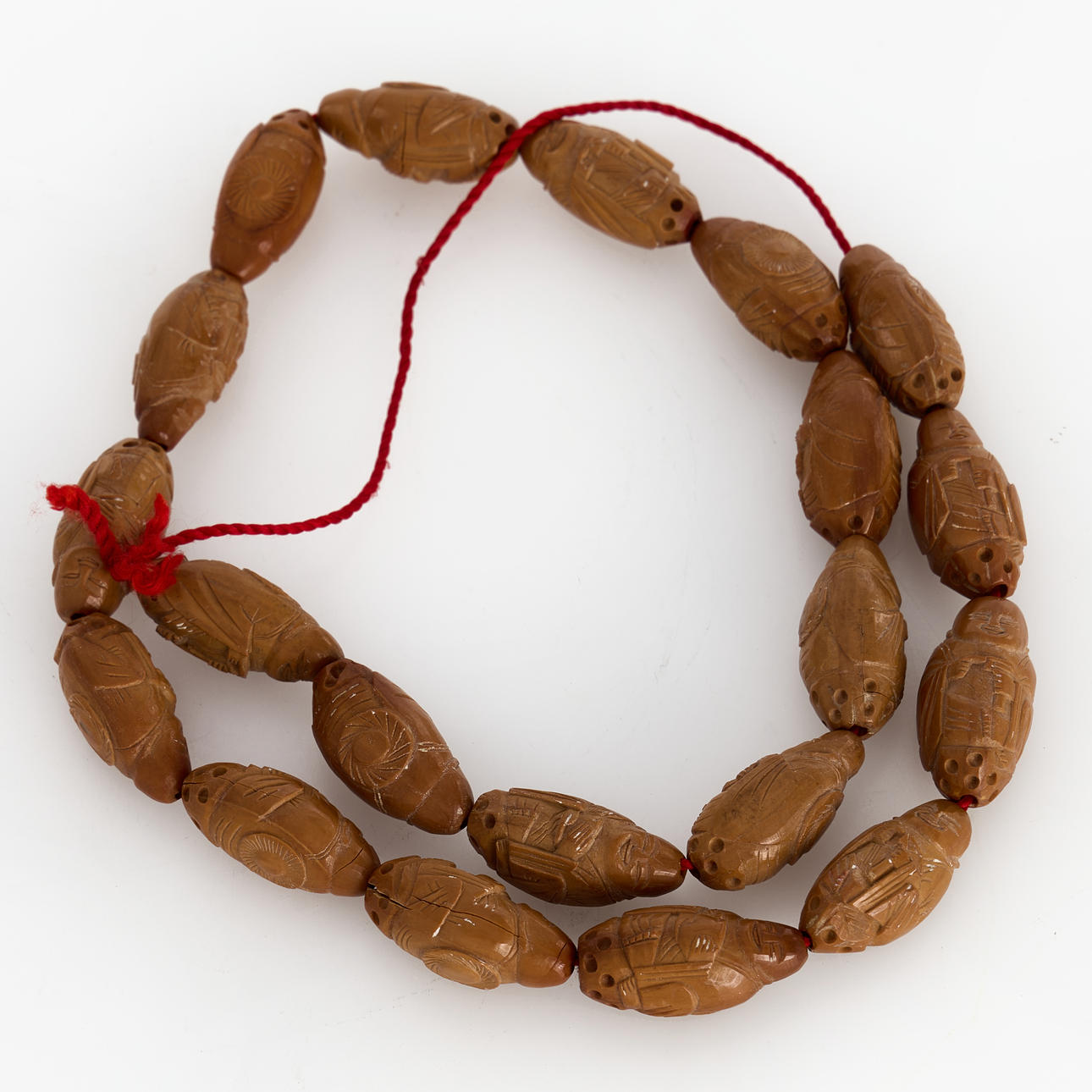 A necklace, olive kernels, “Chinese Olive Stone Carvings”, China, cut ...