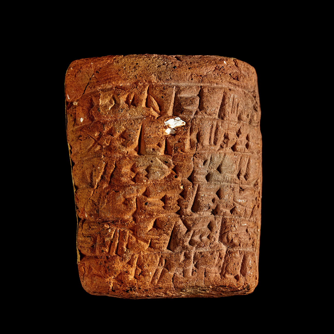 A CUNEIFORM TABLET, Assyria, ca 1500 BC, burnt earthenware, with older ...