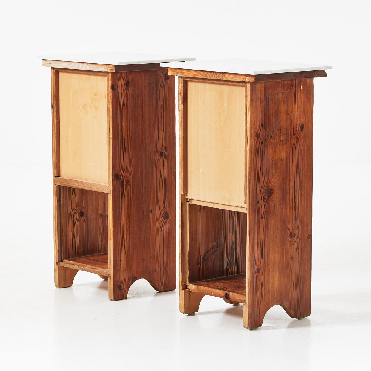 A bedside table, second half of the 20th century, stained pine, cut ...
