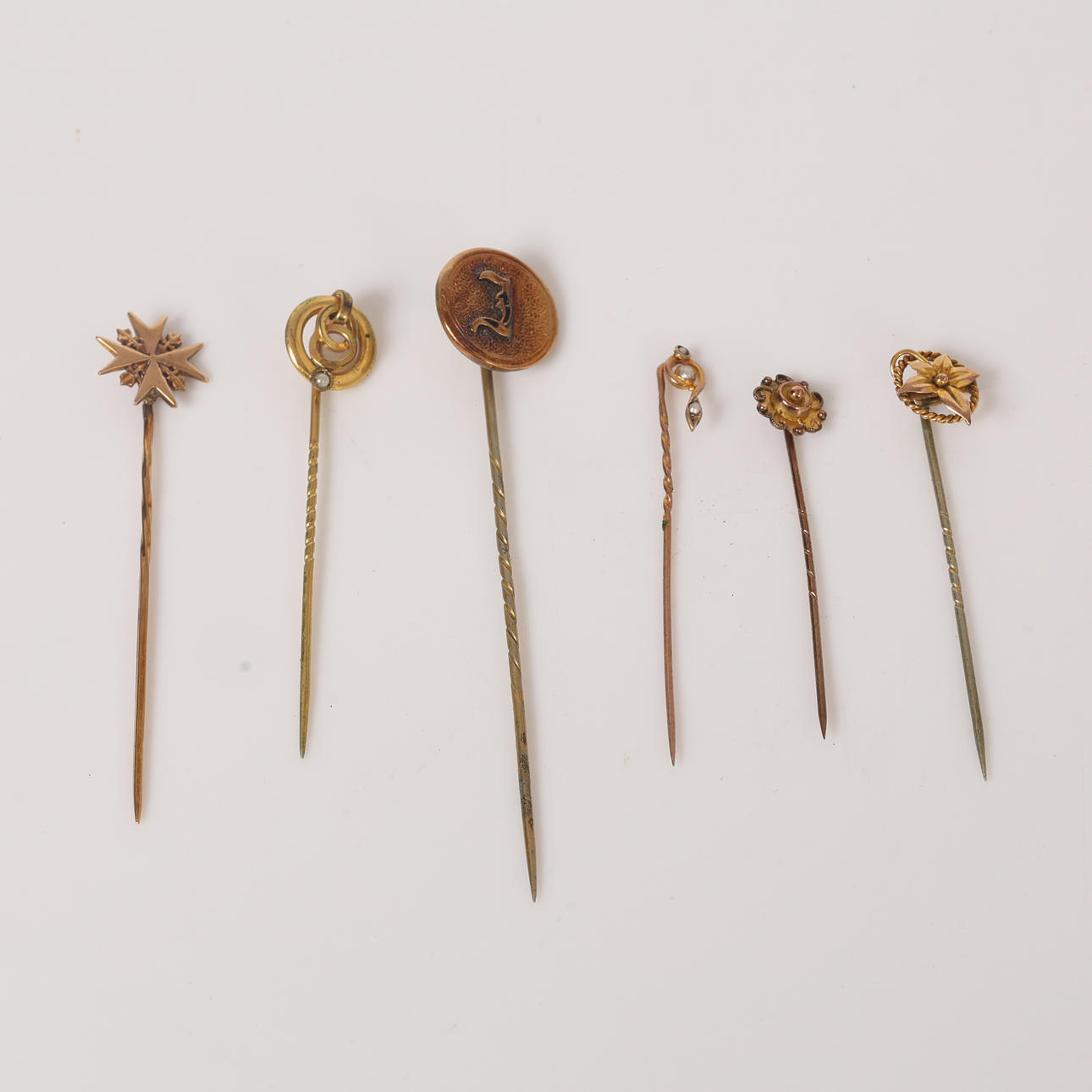 SIX YELLOW METAL STICK PINS (6). Jewellery & Gemstones - Objet de vertu ...