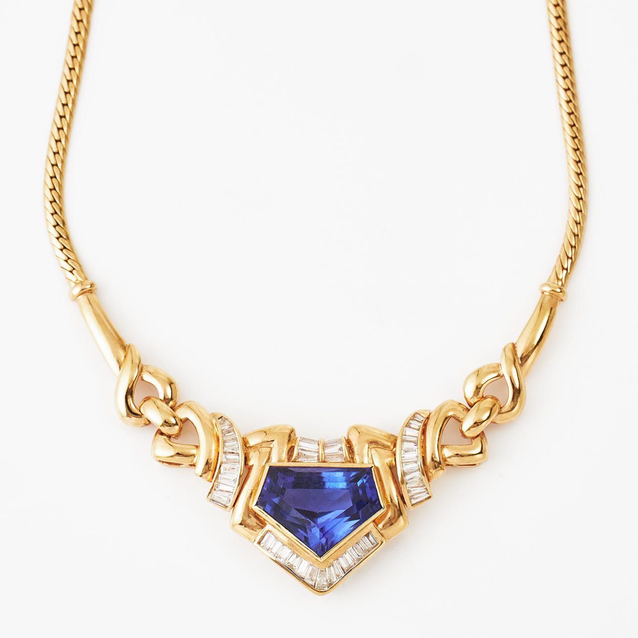 NECKLACE, 18k gold, center part with fantasy cut blue stone, total 39 ...