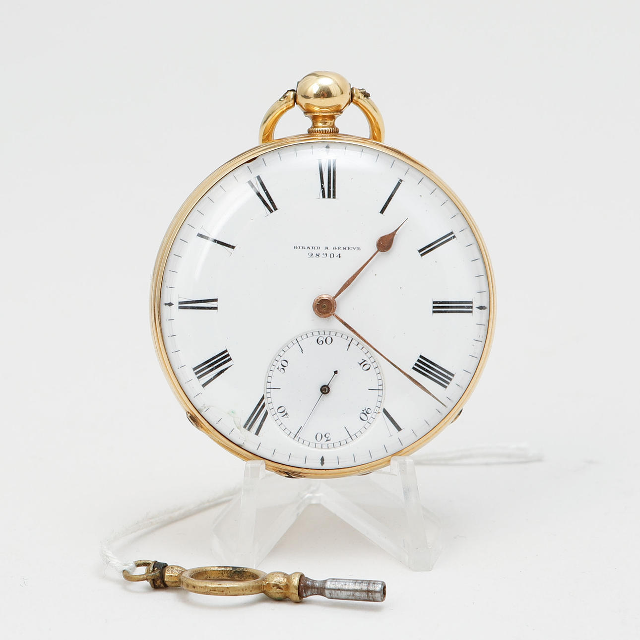A 18k gold Girard à Genève pocket watch, keychain, later half of the ...