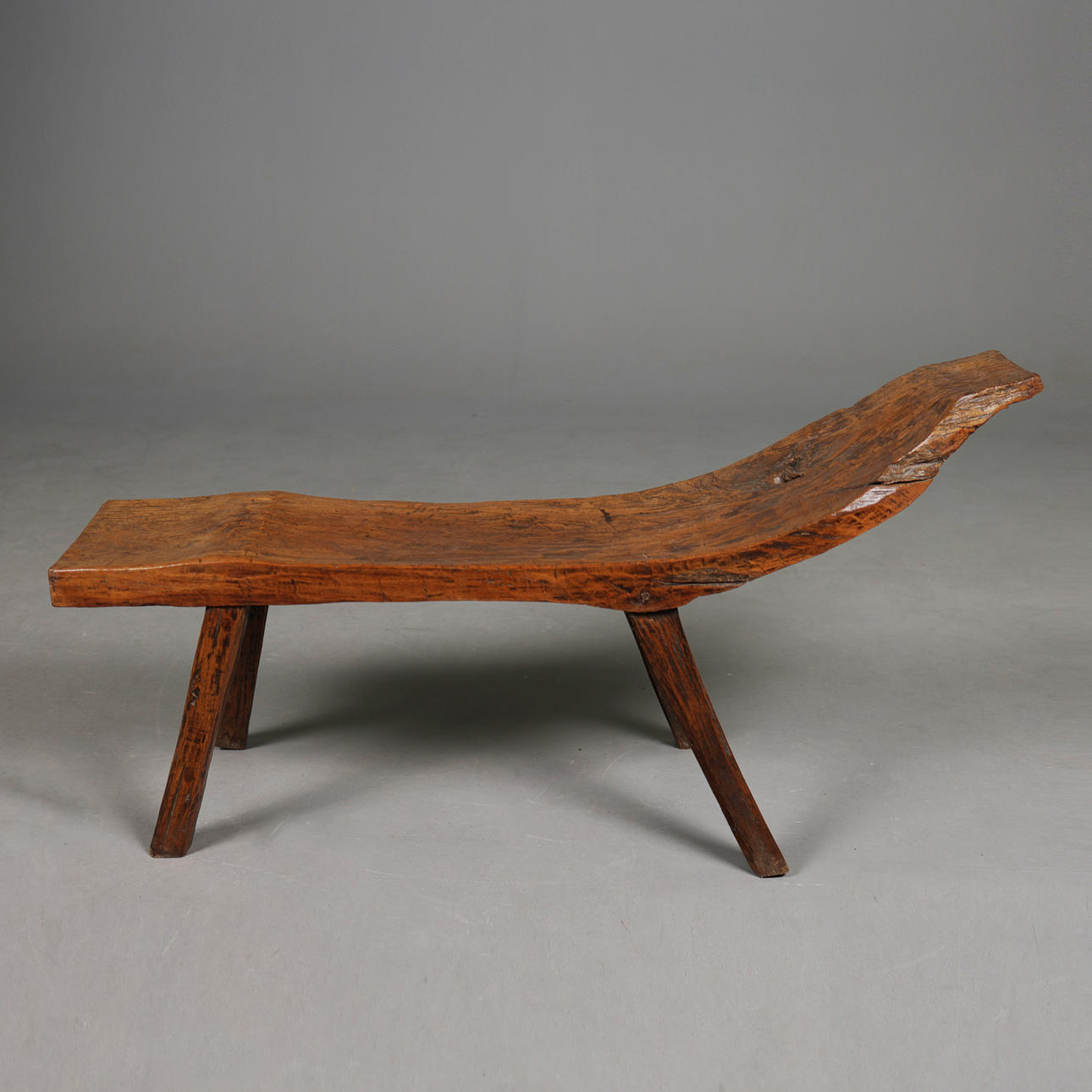 AN AFRICAN TRIBAL CARVED WOOD BENCH. Ethnographica - African tribal art ...