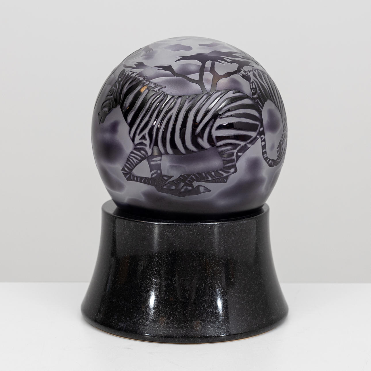 ASTRID GATE. Table lamp, cup of cut overhang glass on black diabase ...