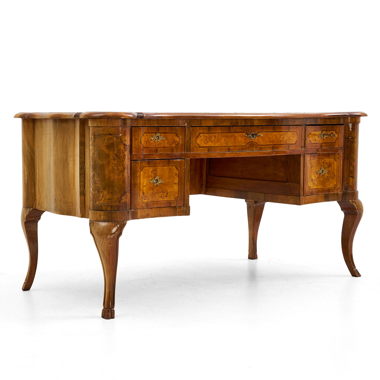 A 19th century desk, late baroque style, mahogany veneer and root ...