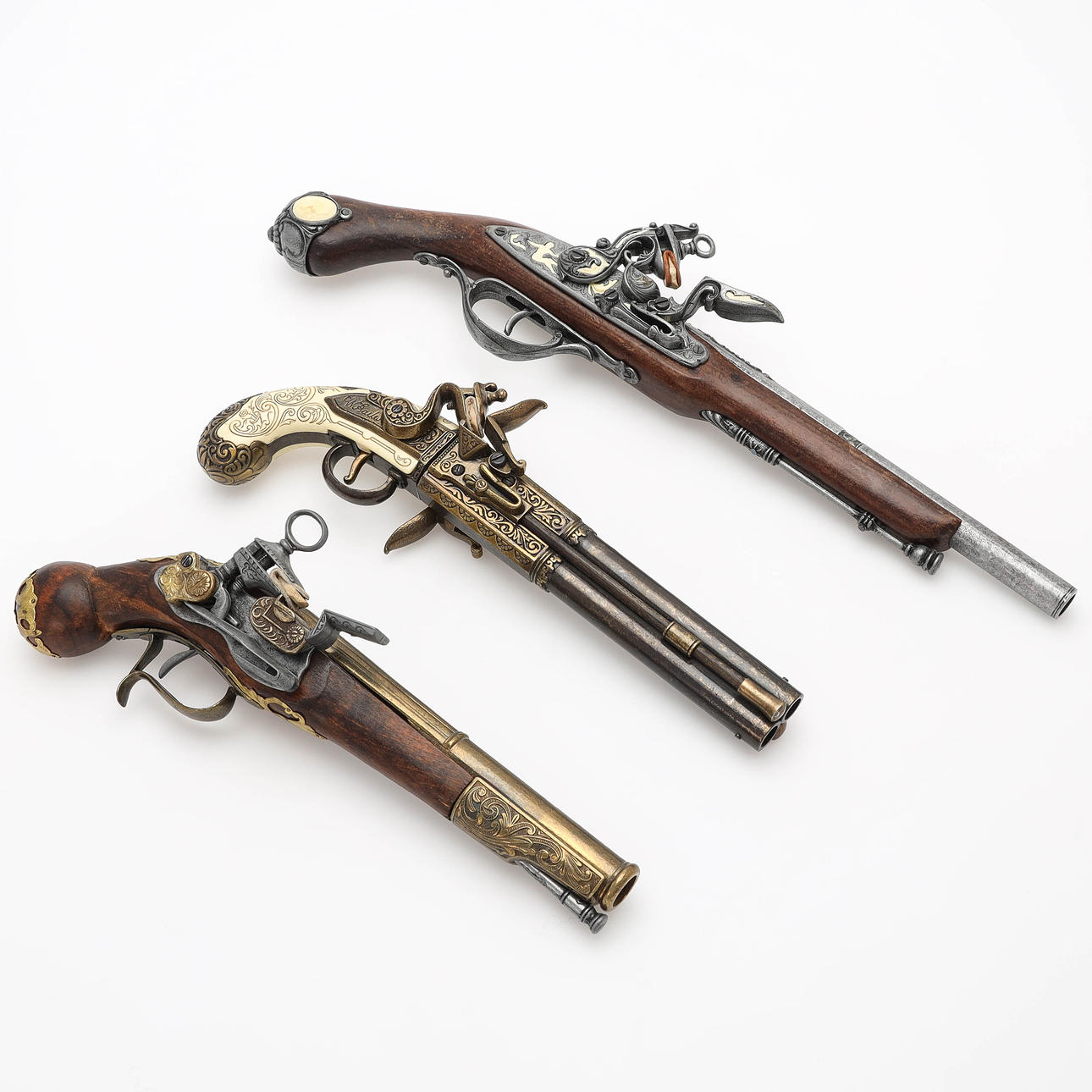 A set of three replica FLINTLOCK PISTOLS, 20th century. Weapons ...