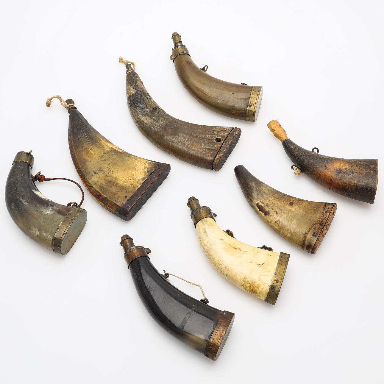 A set of eight 19th century brass horns made of wood. Weapons ...