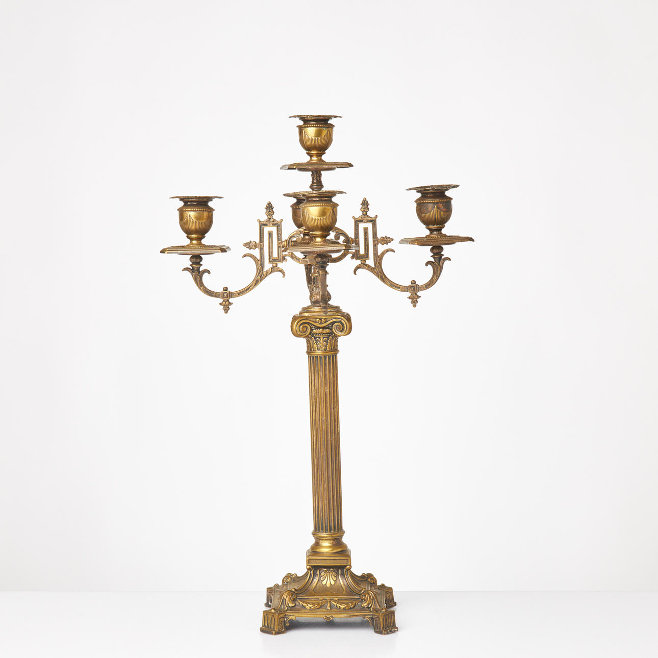 An empire style candelabra, patinated metal, frame in the form of a ...