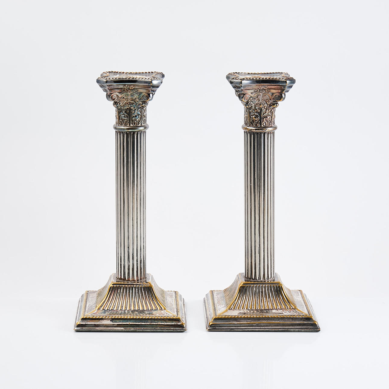 CANDLESTICKS. 1 pair, nickel silver, in the form of columns with ...