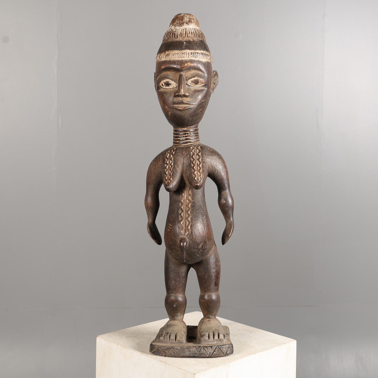 A BAULE STANDING FEMALE FERTILITY FIGURE, IVORY COAST/COTE D'IVOIRE ...