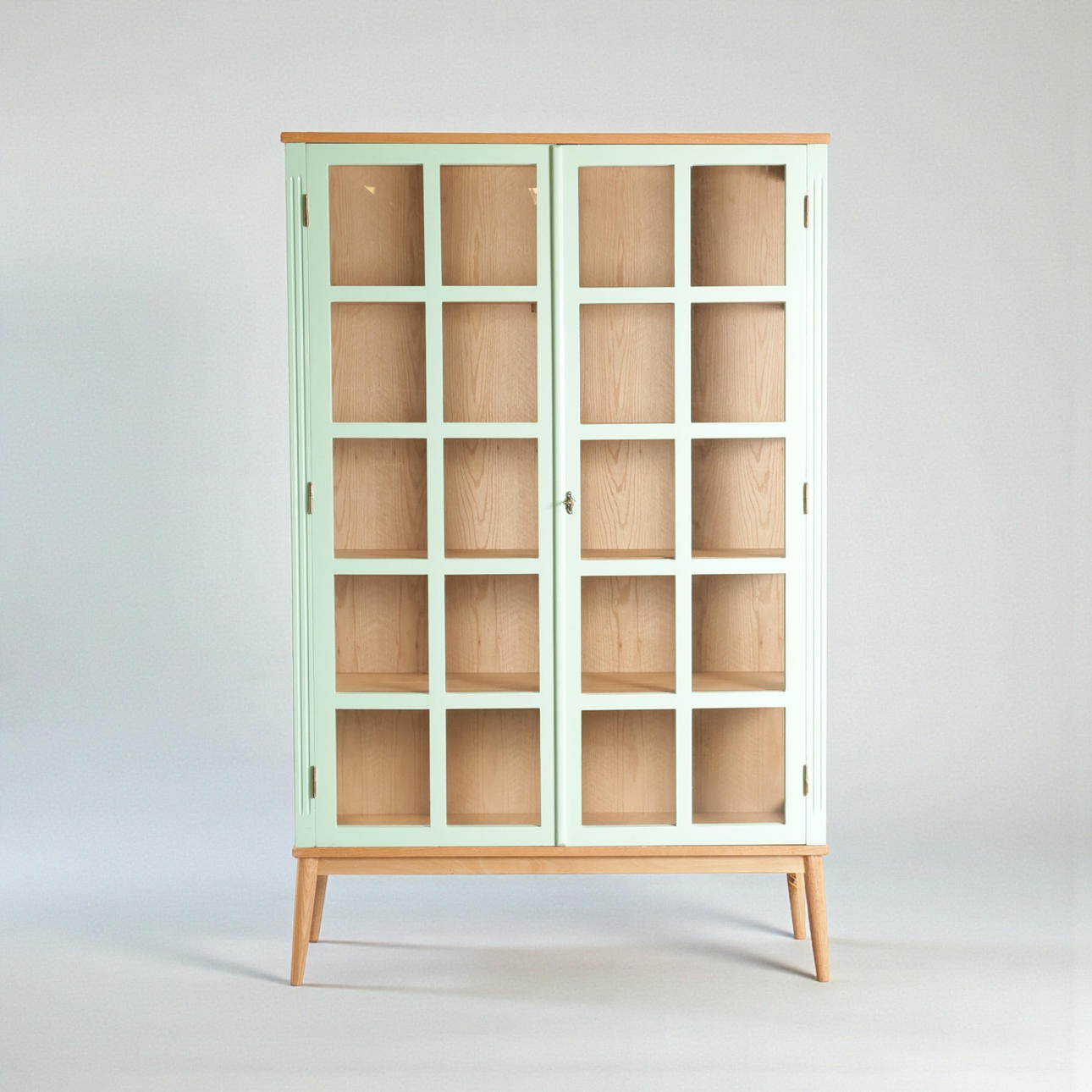 Cabinet of painted wood, clear glass panes in front and sides, set on ...