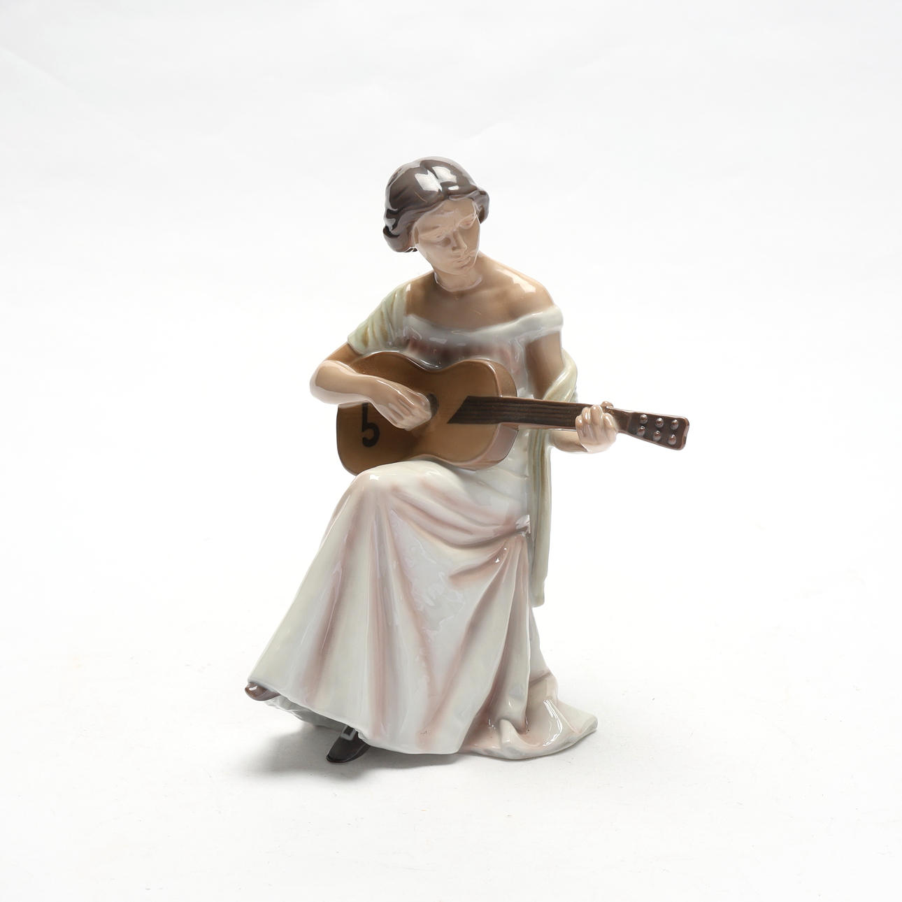 INGEBORG PLOCKROSS IRMINGER. A porcelain figurine of a woman with a ...