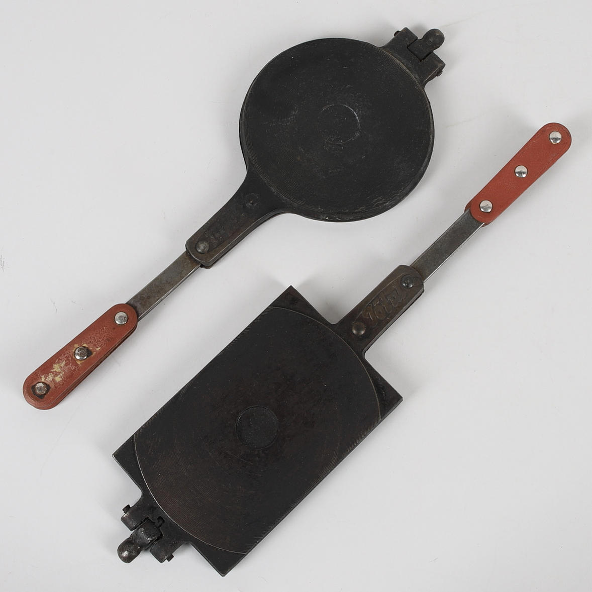 Two cast-iron RÅNJÄRN, Jotul, Norway, later half of the 20th century ...