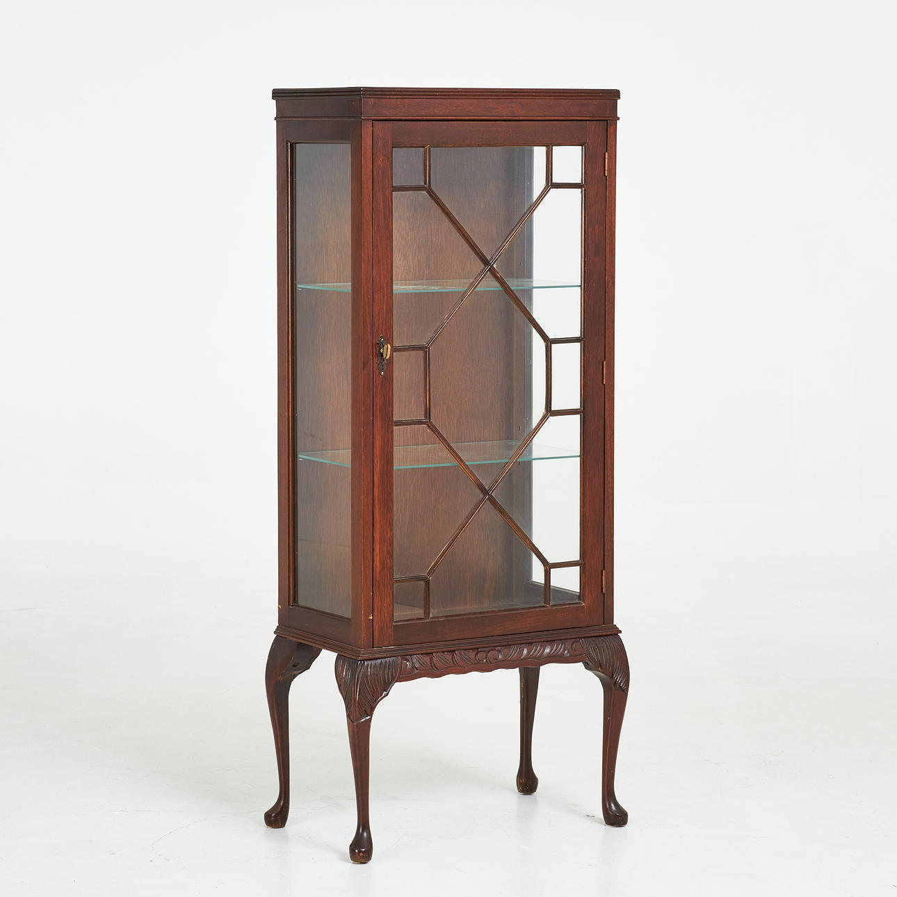 A 20th century display cabinet, mahogany, glazed sides, door with slit ...